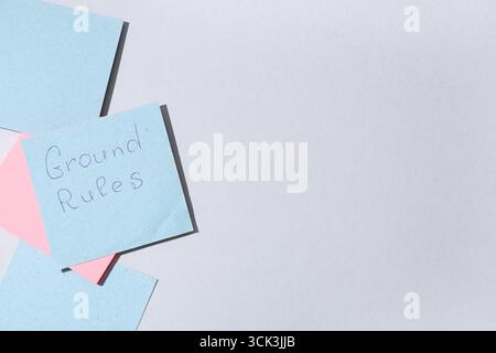 Sticky notes with text GROUND RULES on light background Stock Photo - Alamy