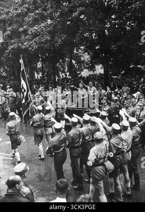 Adolf Hitler in Mercedes open car acknowledges the Nuremberg ecstatic ...