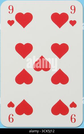 This image shows a playing card featuring the number 9 of spades, with ...