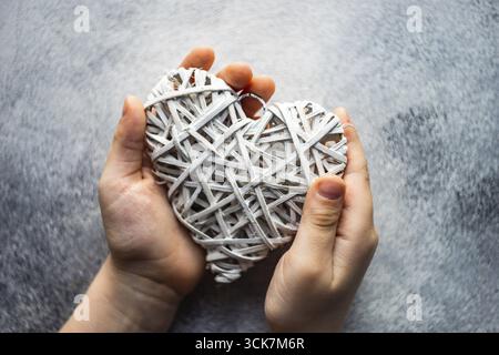 St. Valentine card concept with heart shaped decor on wooden background ...