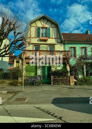 Red tiled roof. CLouds in blue sky. Green tree Stock Photo - Alamy