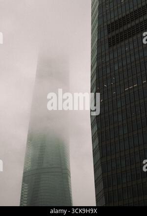 A fog-shrouded city view through the banister Stock Photo - Alamy