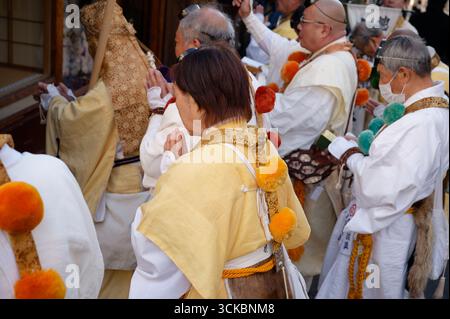 Female monk in Kyoto, Japan. Holding shakujo staff, wearing a gasa ...