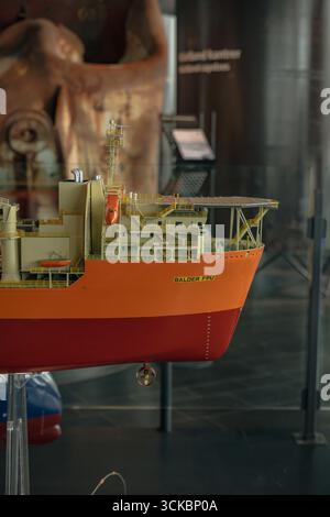 A detailed scale model of an offshore oil rig displayed in a museum ...