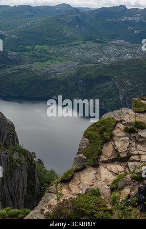 A breathtaking view of rocky mountains seen through tree branches Stock ...