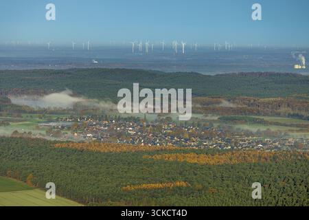 Wind turbines behind village church, Woltersdorf, Saxony-Anhalt ...