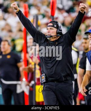 Washington Commanders head coach Dan Quinn participates in a drill with ...