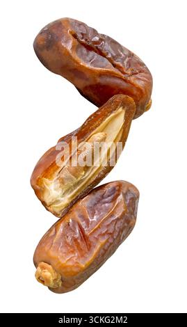 Ripe dried date palm fruits witth half in stack in set are isolated on ...