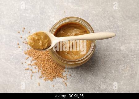 Different types of mustard on light grey table, flat lay Stock Photo ...