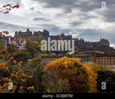 Overcast cloudy autumn sky surrounded from bottom and sides by yellow ...