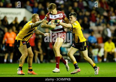 Wigan Warriors' Sam Walters is tackled during the Betfred Super League ...