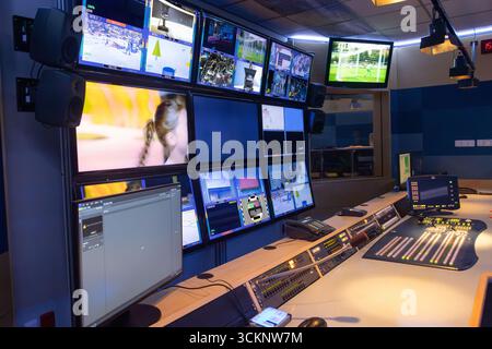 Interior view of a fully equipped broadcast studio with multiple ...