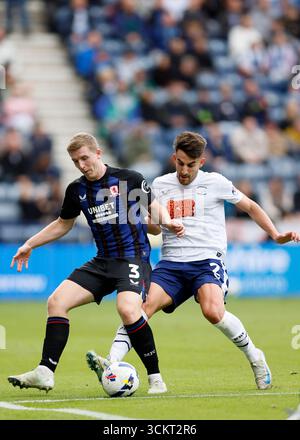 Pol Valentin of Preston North End FC and Craig Forsyth of Derby County ...