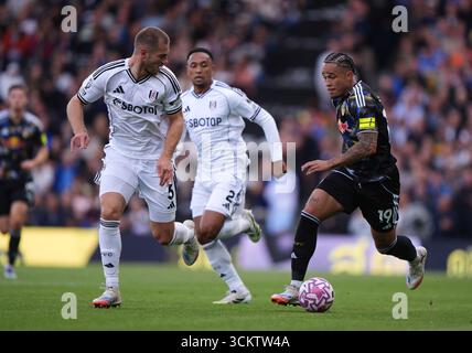 Leeds United's Noah Okafor and Fulham's Timothy Castagne (right) battle ...