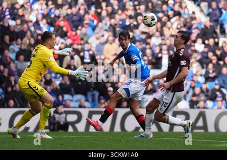 Heart of Midlothian's Oisin McEntee (left) and Celtic's Kieran Tierney ...