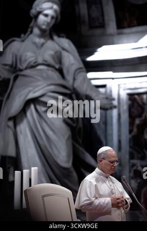 Pope Leo XIV meets pilgrims holding a peace torch during his weekly ...