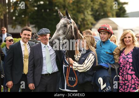 Fallen Angel with jockey James Doyle and trainer Karl Burke (left) in ...