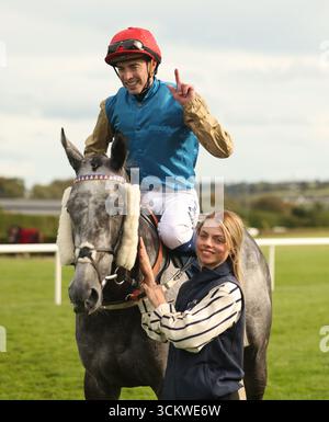 Fallen Angel with jockey James Doyle and trainer Karl Burke (left) in ...