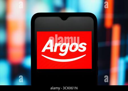 In this photo illustration, the Argos logo is displayed on a smartphone ...