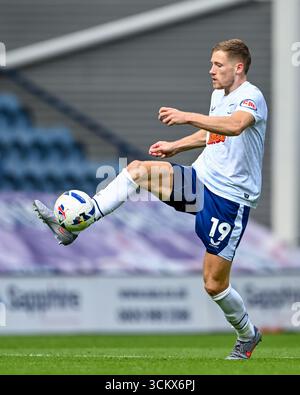 Lewis Gibson of Preston North End scores his team's first goal during ...