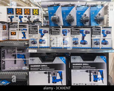 Drills on shelves in hardware store Stock Photo - Alamy