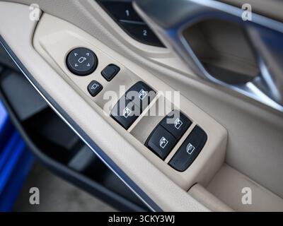 electric window control switches inside a modern car, focusing on the ...