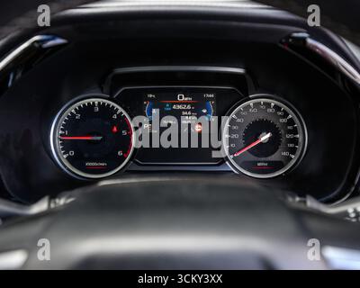 car instrument cluster featuring a speedometer and tachometer ...