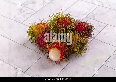 Sweet ripe juicy haired rambutan fruit Stock Photo - Alamy