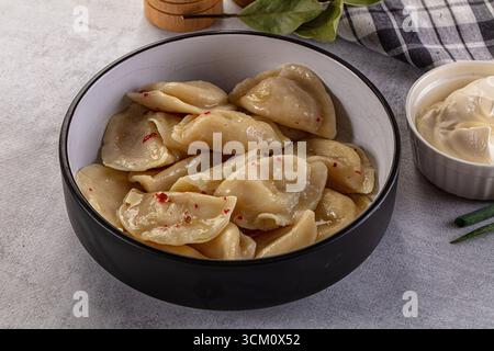 Traditiolal vareniki - stuffed dumplings with potato and onion Stock ...