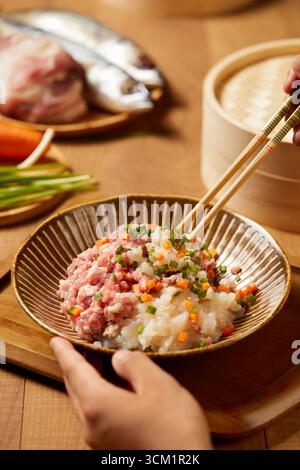 Preparing Ingredients for Chinese Dumplings – Pork, Vegetables, and ...
