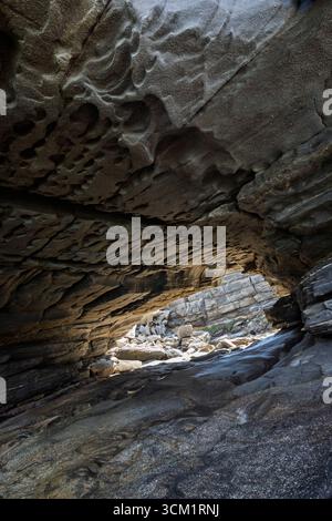 Inside the stunning & large natural stone arc at the Paros Park on ...