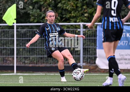 Angel Kerkhove (13) of Brugge pictured fighting for the ball with Luna Vanzeir (30) of ...