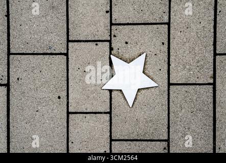 Stars on sidewalk as memorial for Nazi victims, Tilbeck Abbey, Tilbeck ...