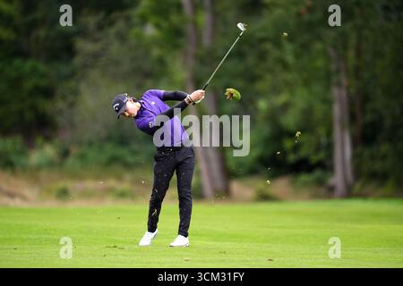 Min Woo Lee of Australia plays a shot in round one of the Australian ...