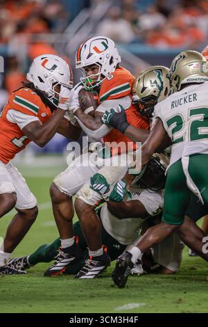 Miami running back Charmar Brown (6) celebrates after scoring during ...