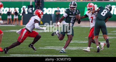 Michigan State quarterback Aidan Chiles (2) signs an autograph for a ...