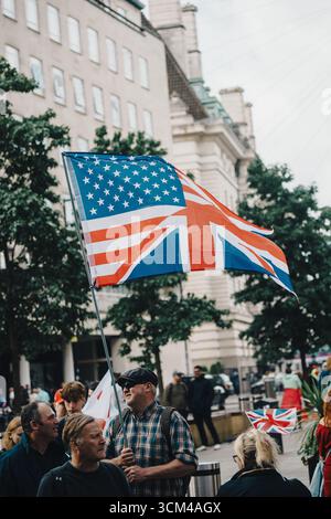 A protester holds a Union Jack during the protest outside the Connors ...