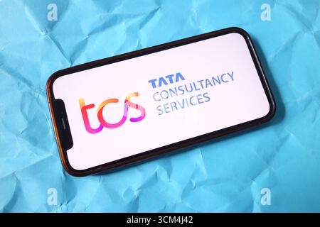 In this photo illustration, the Tata Consultancy Services (TCS) logo is ...