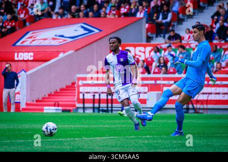 Yann Gboho of Toulouse Football Club and Julio Enciso of Strasbourg ...