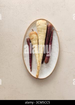Purple carrots and parsnips Stock Photo - Alamy