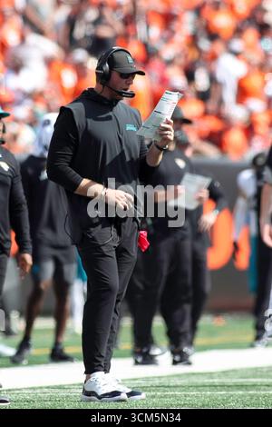 Jacksonville Jaguars head coach Liam Coen talks to wide receiver Parker ...