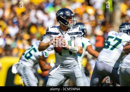 Seattle Seahawks quarterback Sam Darnold (14) throws under pressure ...