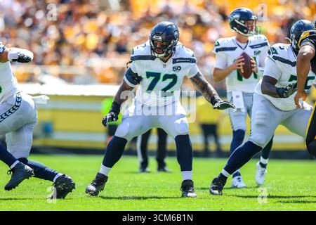 Seattle Seahawks offensive tackle Abraham Lucas (72) faces off against ...