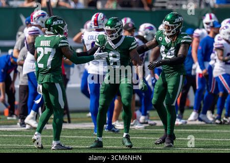 New York Jets safety Malachi Moore (27) shoves Tampa Bay Buccaneers ...