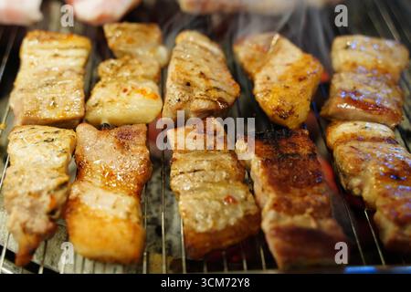 Korean Samgyeopsal (Pork Belly) Grilling on Hot Plate Stock Photo - Alamy