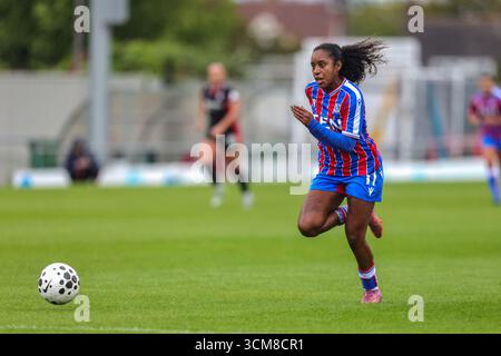 11, Ashleigh Weerden of Crystal Palace is pressured by 22, Nelly Las of ...