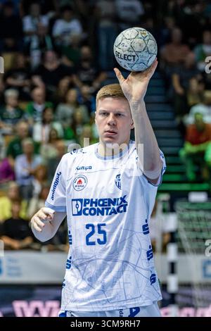 Niels Versteijnen (TBV Lemgo Lippe, #25) jumps to score a goal, Foot ...