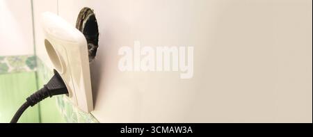 Dangerous broken electrical socket falling out of wall Stock Photo - Alamy