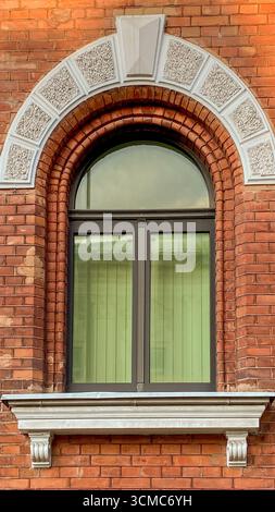 Ornate large arched windows. Great decorated historic building facade ...