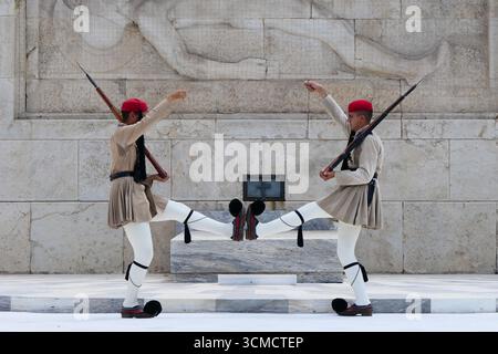 Two handsome guardsmen of the Honor Guard froze in unison before the ...
